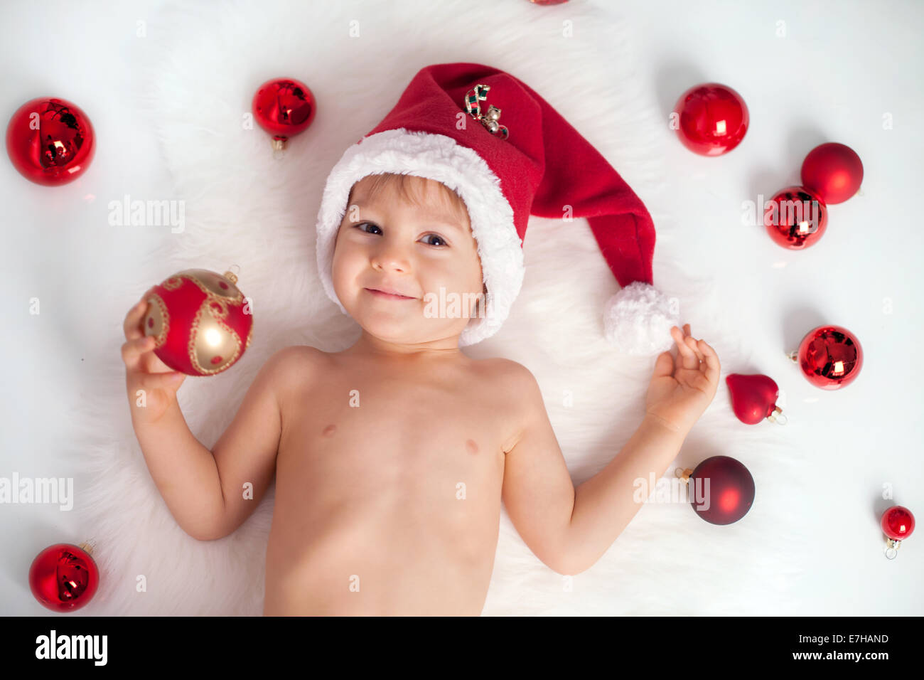 Boy with christmas hat Stock Photo - Alamy