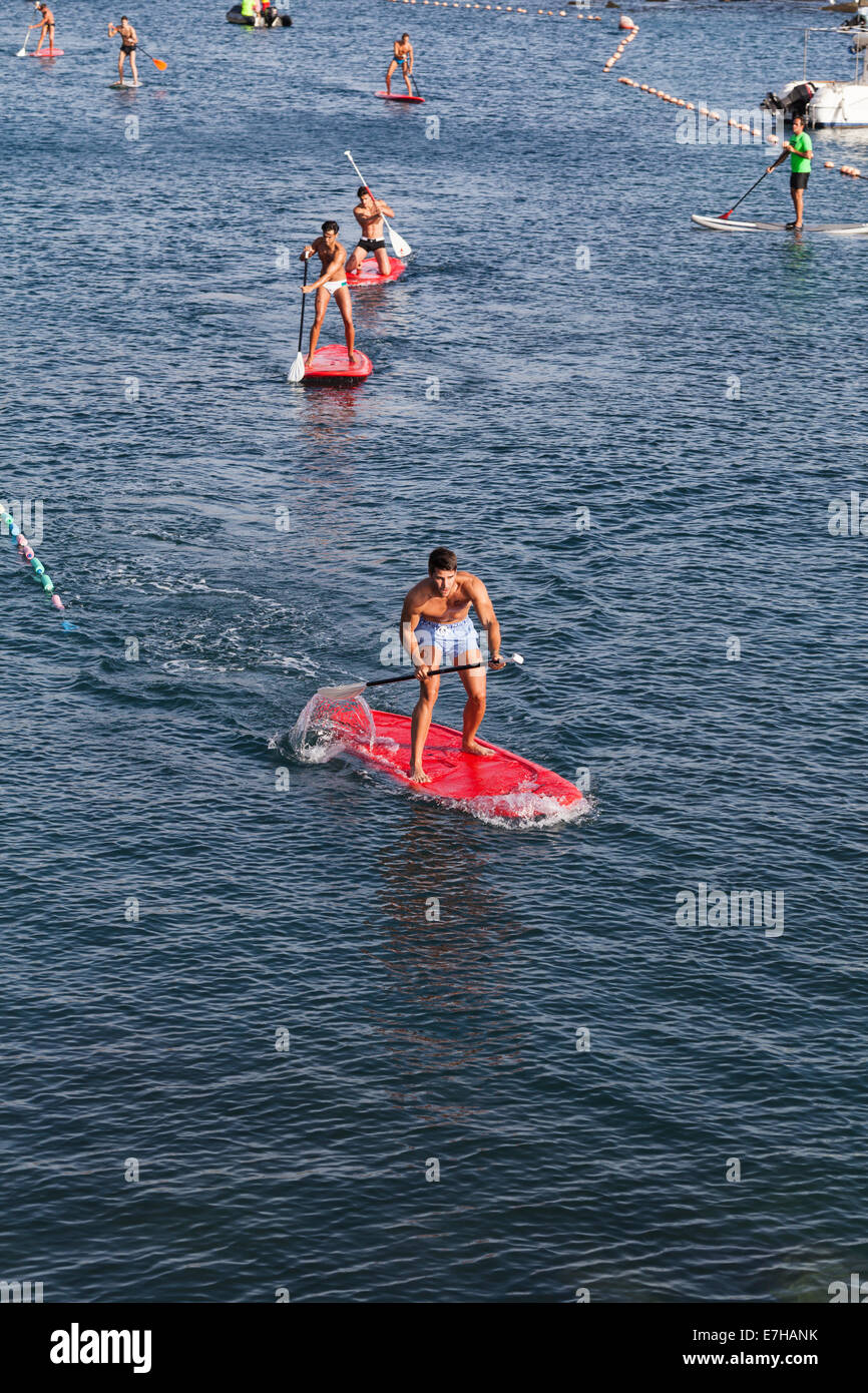 Mister International Espana contestants take part in a paddle board ...