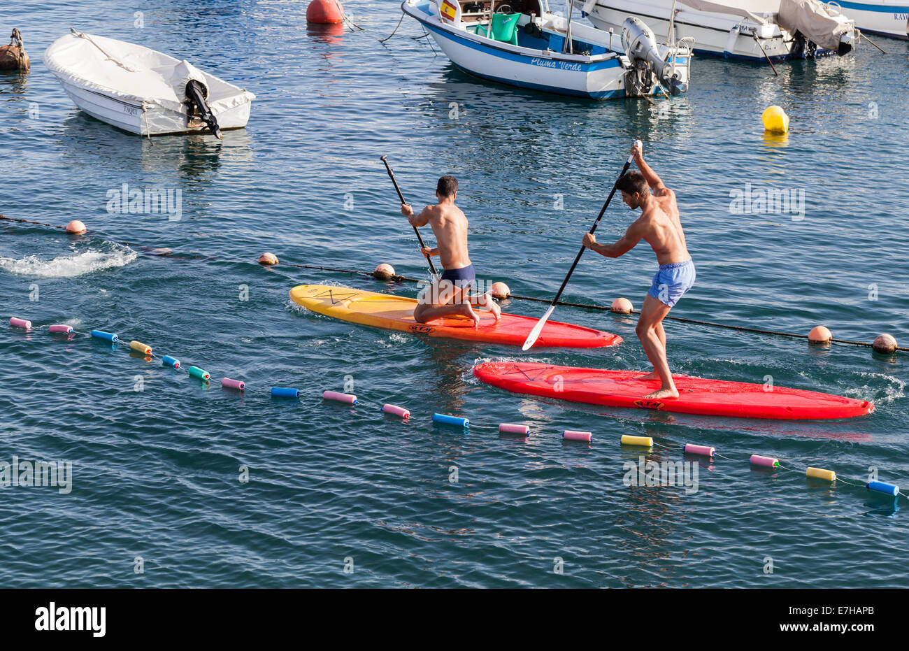 Mister International Espana contestants take part in a paddle board ...