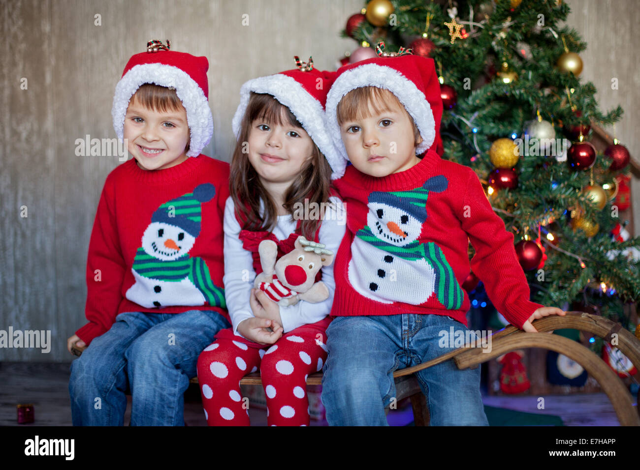 Christmas surprise with three friends hi-res stock photography and ...