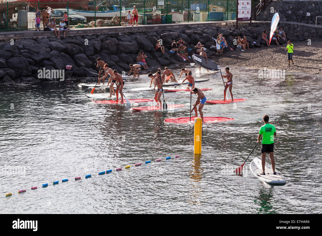 Mister International Espana contestants take part in a paddle board ...