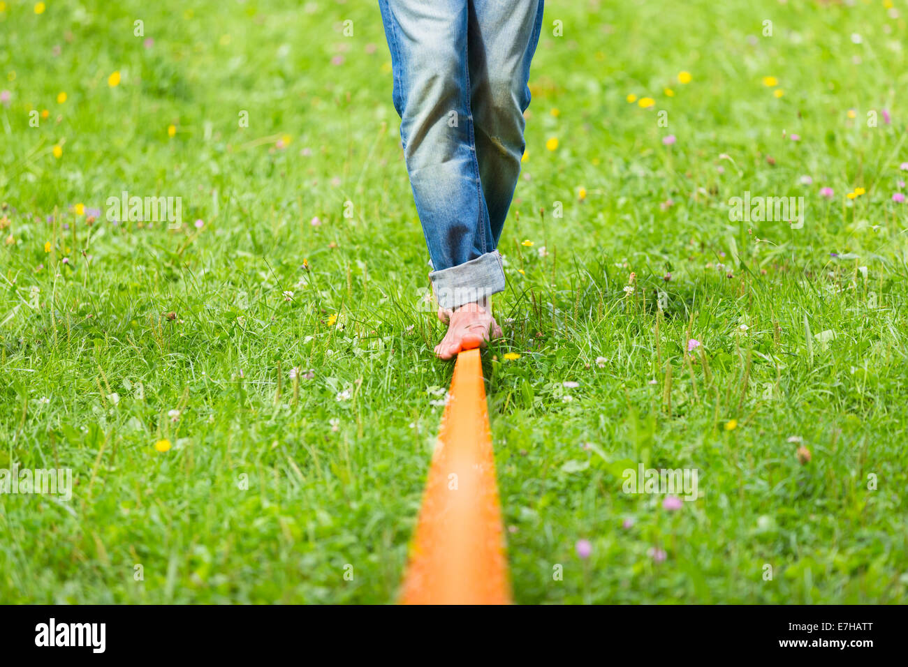 Slack line in the city park Stock Photo - Alamy