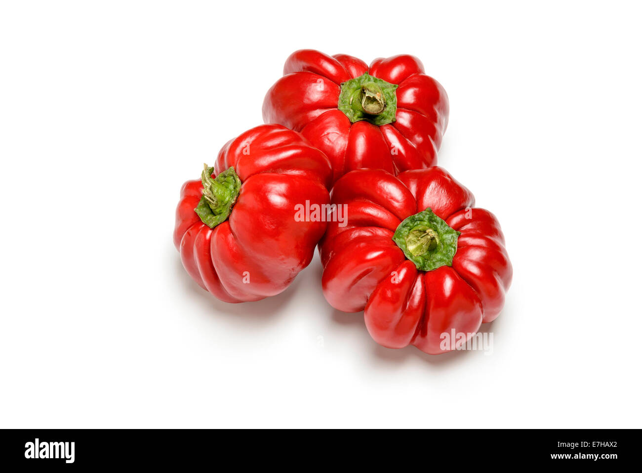 Three bell peppers from the kitchen garden, isolated on white ...