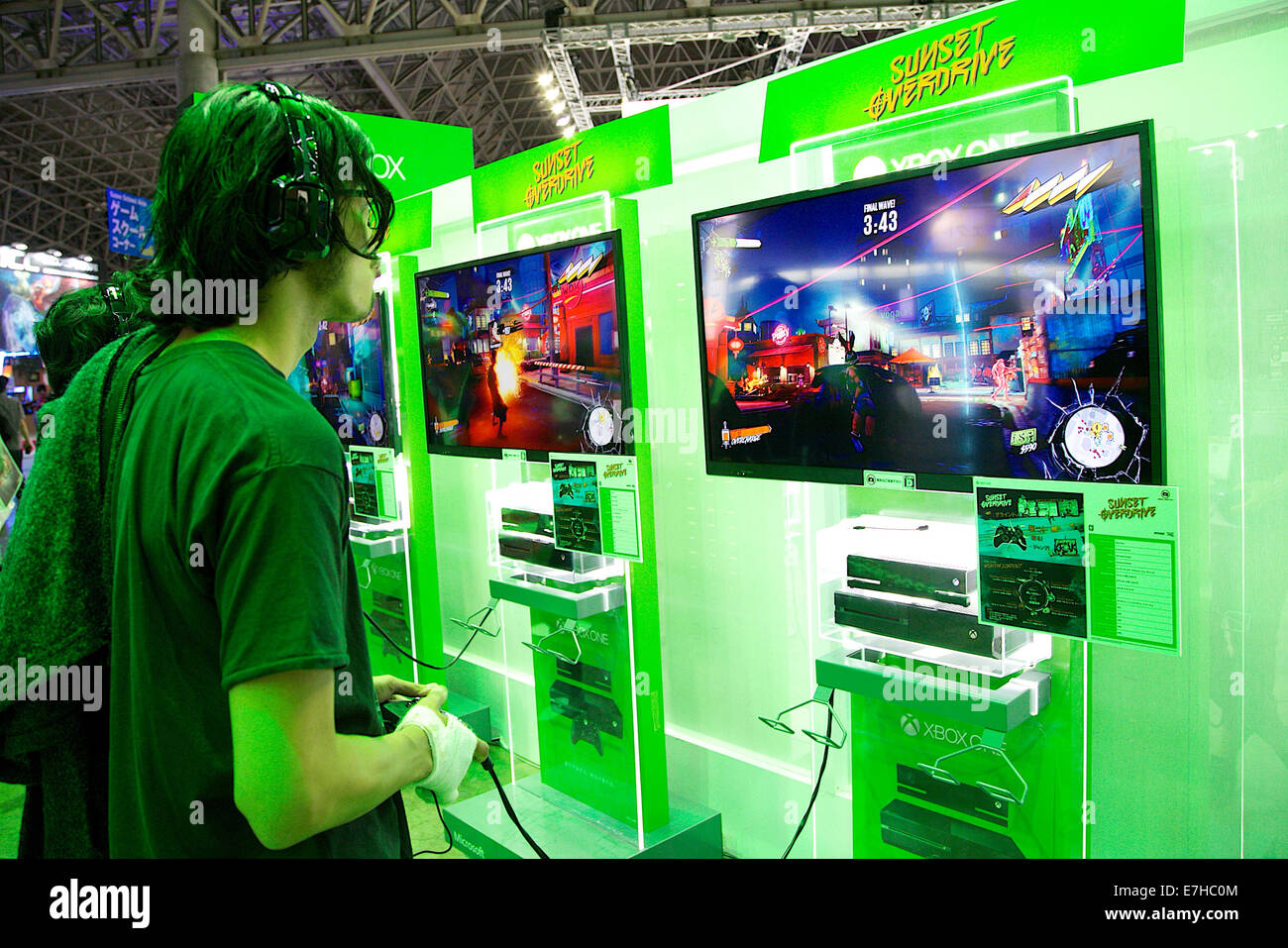 A visitor tests the latest technology innovations in video game devices ...