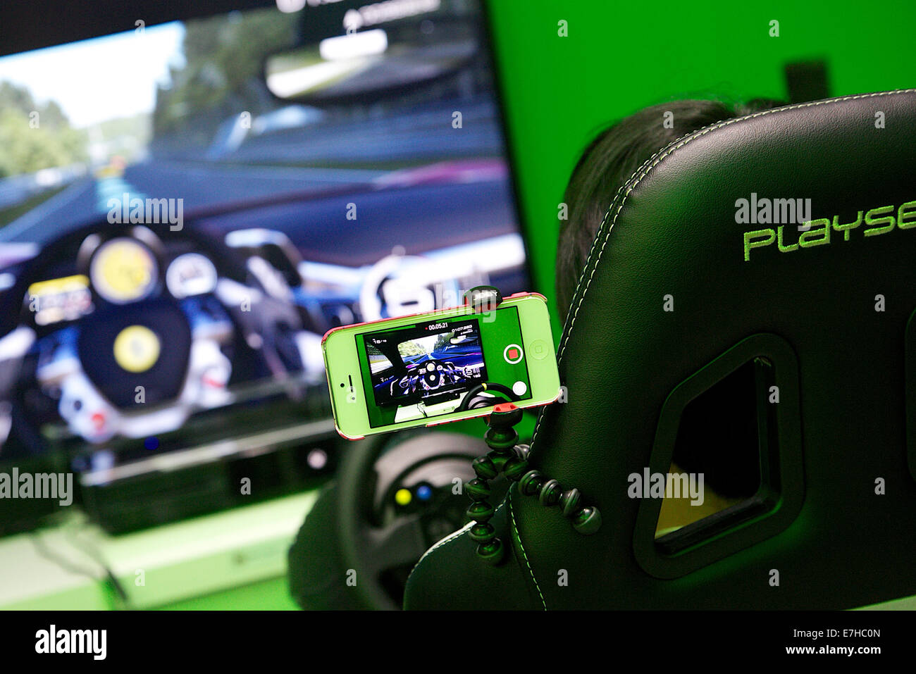 A visitor tests the latest technology innovations in video game devices ...