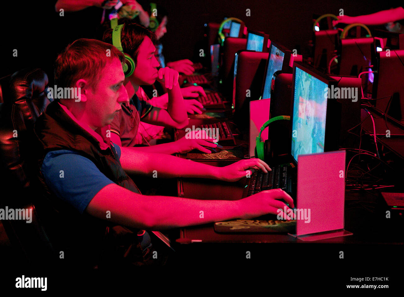 Visitors test the latest technology innovations in video game devices ...