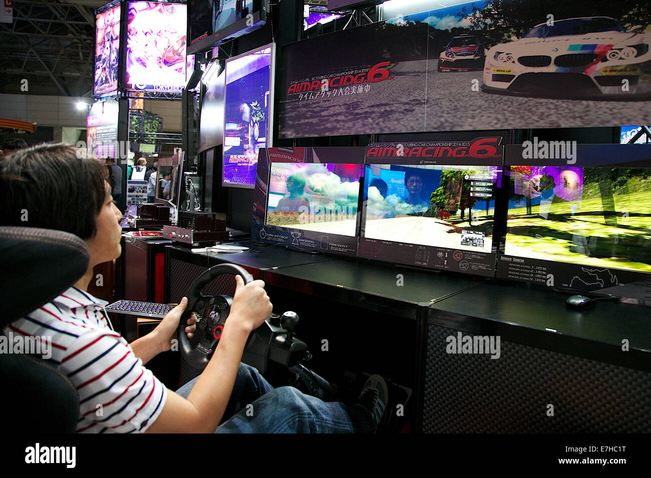 A visitor tests the latest technology innovations in video game devices ...