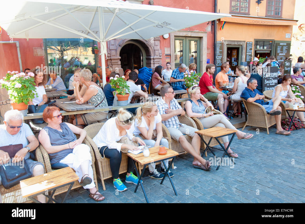 Sweden, Stockholm - People sitting at cafe in The Old Town Stock Photo ...