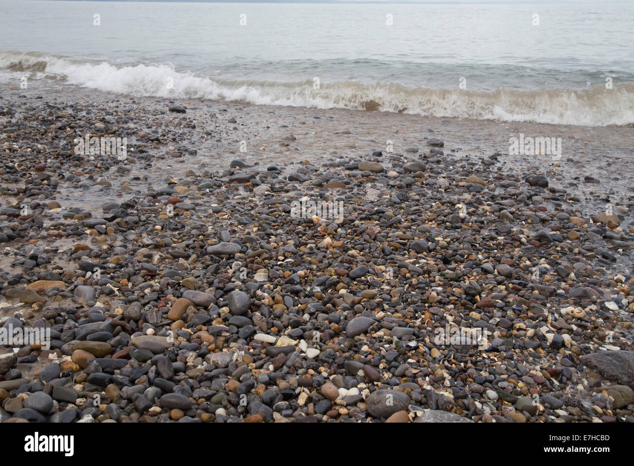Pebble beach background Stock Photo - Alamy