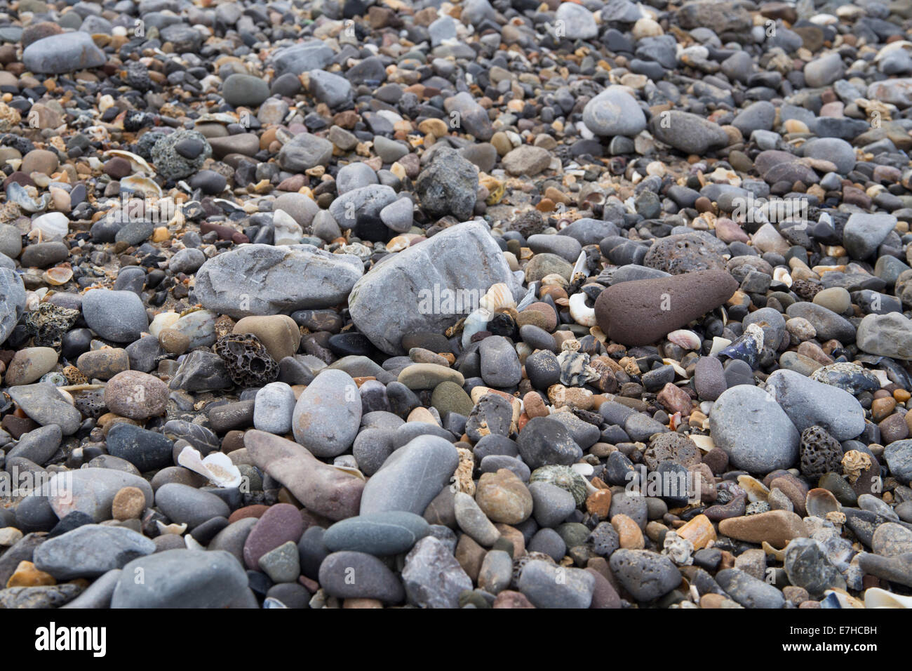 Pebble beach background Stock Photo - Alamy