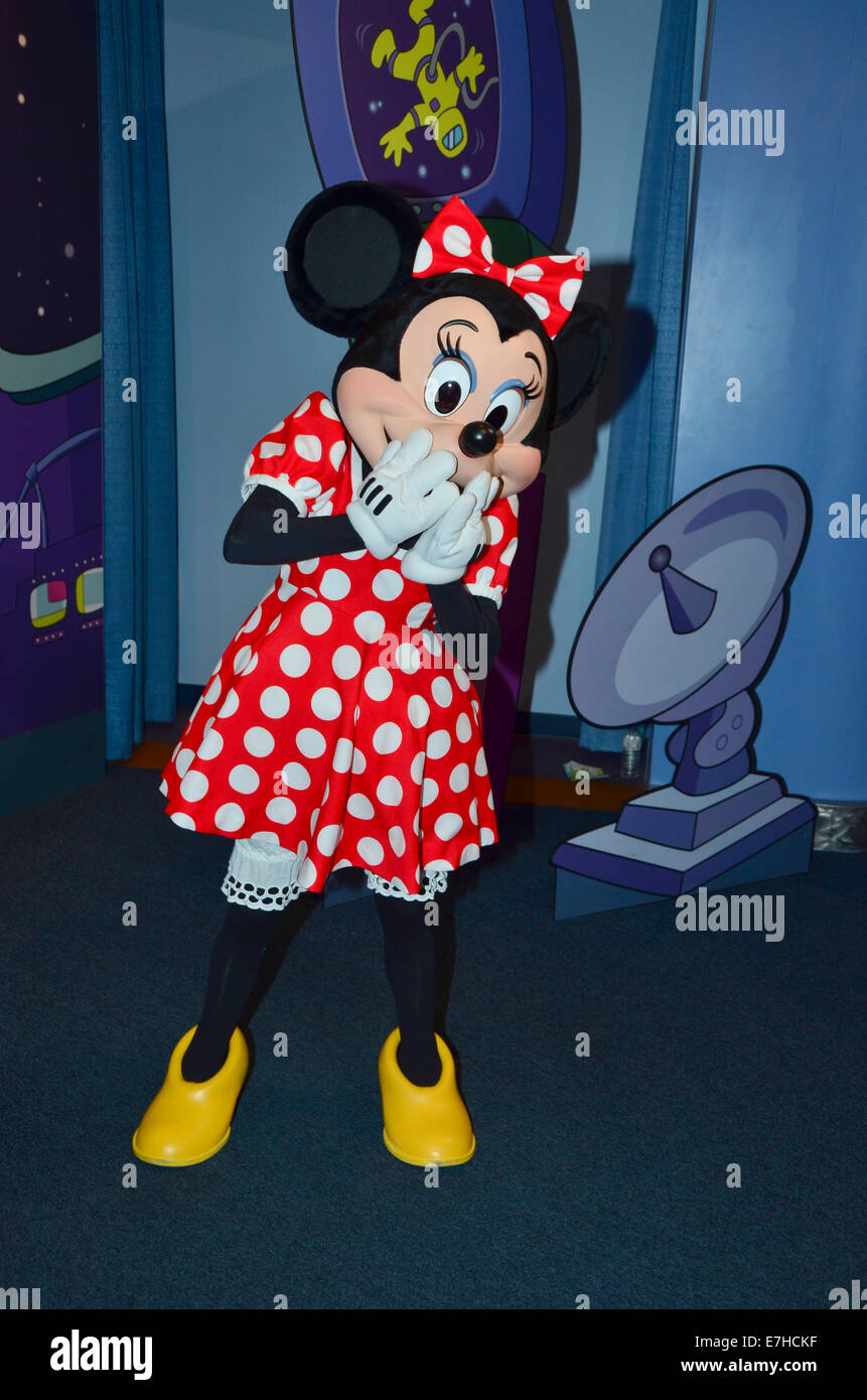 Minnie Mouse poses for photographs at Magic Kingdom, Walt Disney World ...