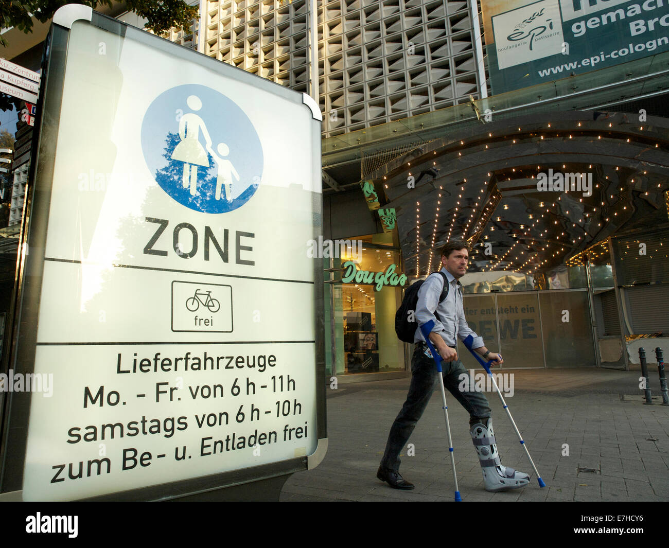 Pedestrian zone sign in Cologne, Germany, with man with broken leg and ...