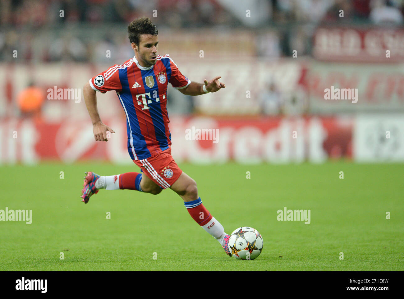 Munich, Germany. 17th Sep, 2014. Bayern Munich's Juan Bernat controls ...