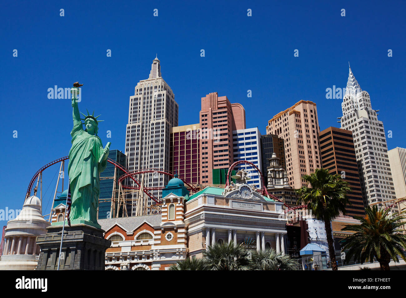 Replica Statue of Liberty and roller coaster on exterior of New York ...