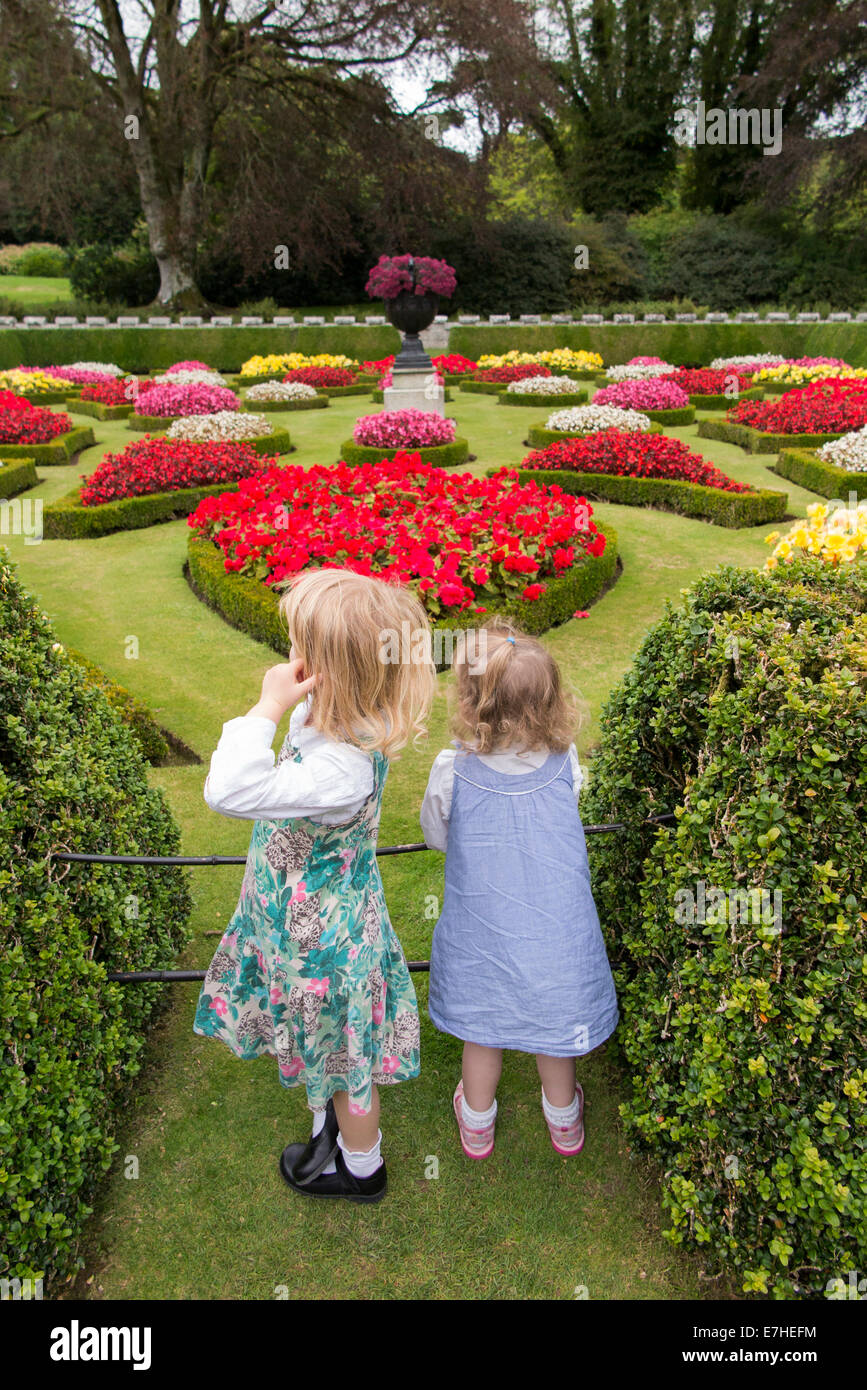 Two sisters / girls / child / children / kid / kids in the garden ...