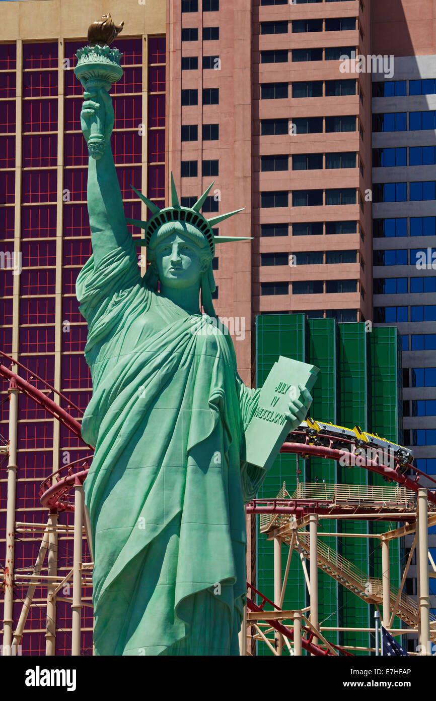Replica Statue of Liberty and roller coaster on exterior of New York ...
