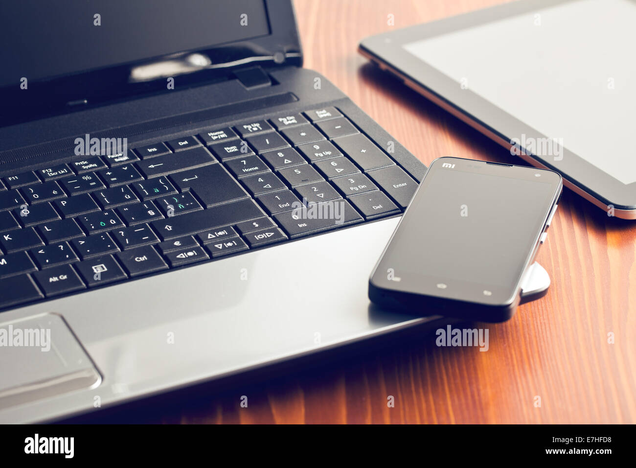 laptop and smartphone on office table Stock Photo - Alamy