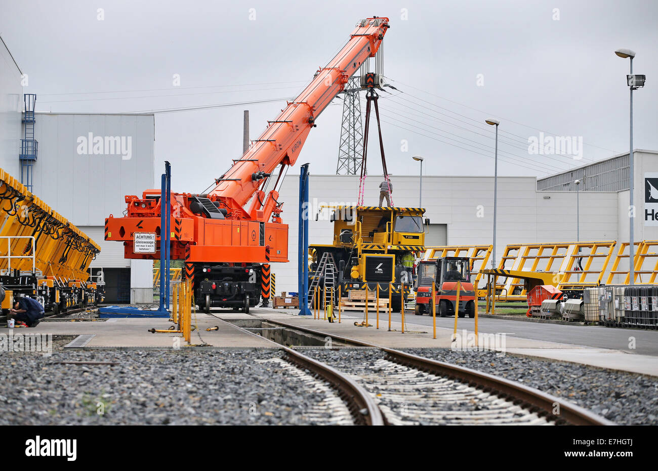 Employees of Kirow Ardelt GmbH use one of their own railway cranes to ...