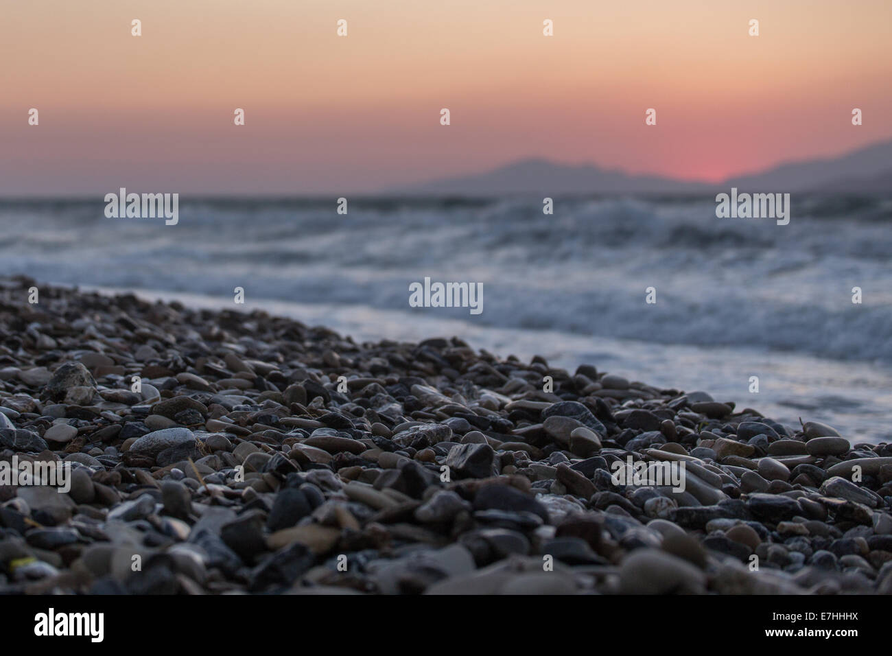 Pebble/shingle beach on sunset Stock Photo - Alamy