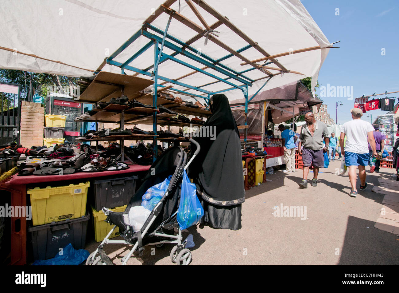 Women market shoe stall hi-res stock photography and images - Alamy