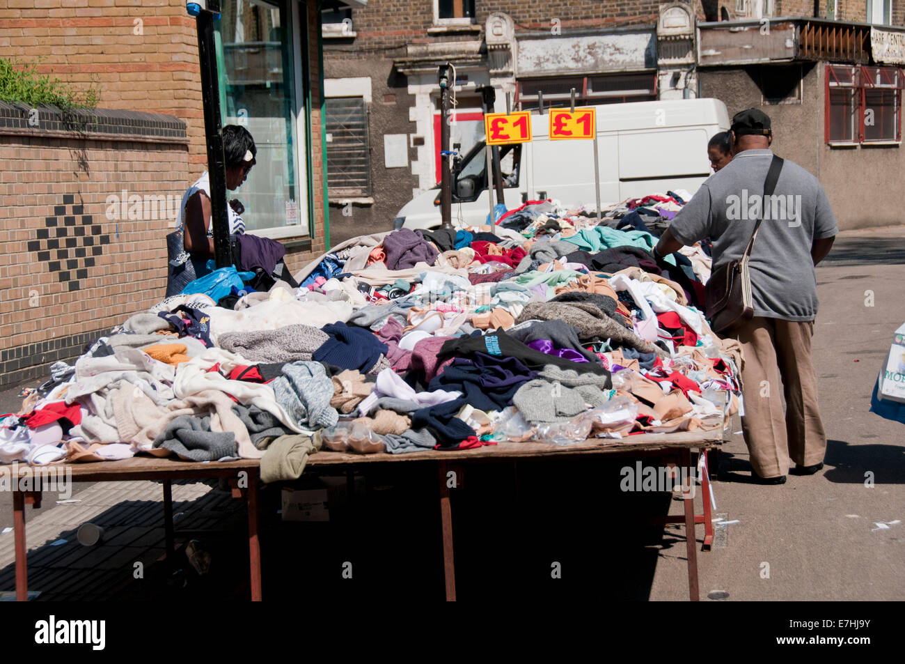 Second hand clothes stall in East Lane market South London Stock Photo ...