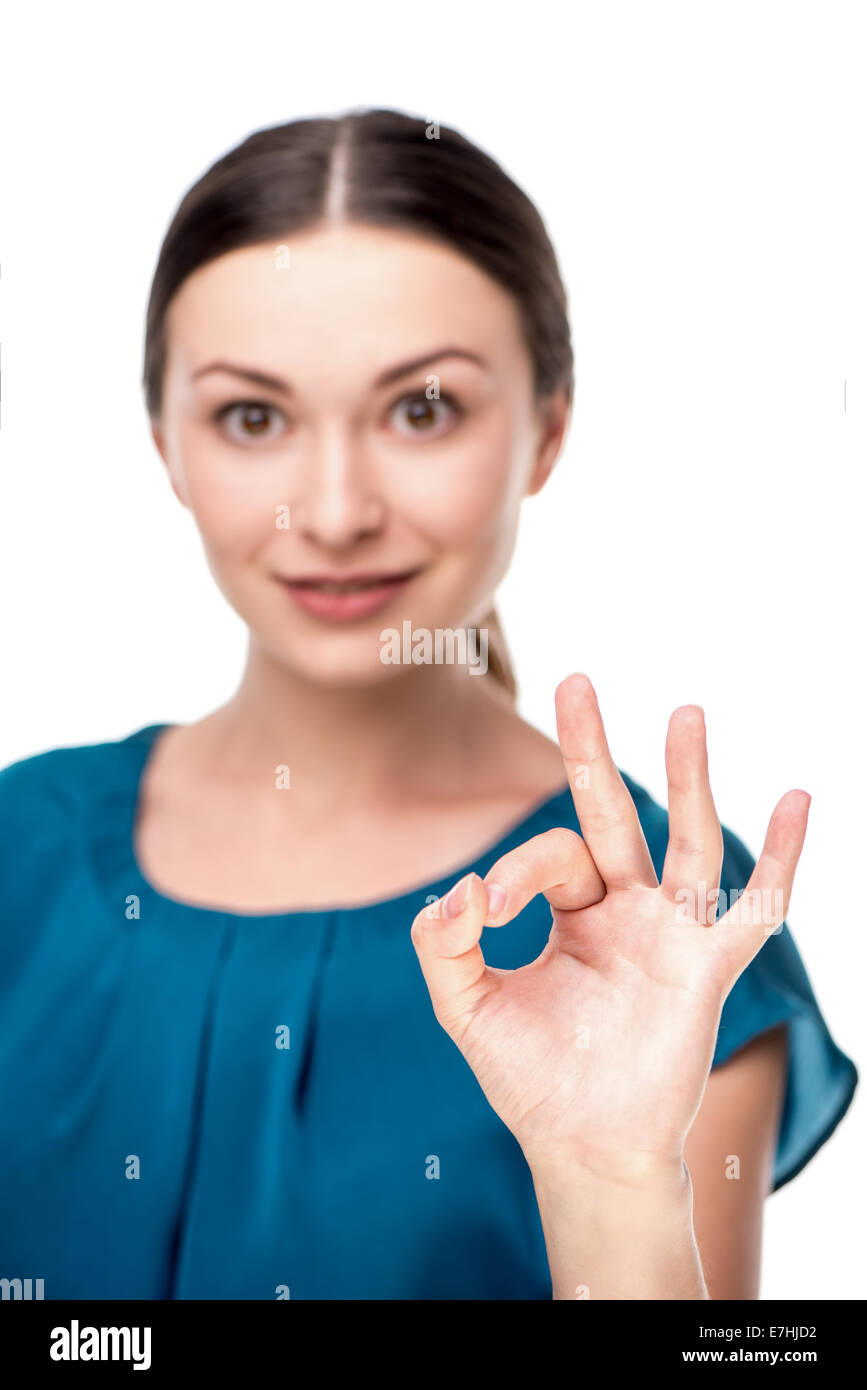 Smiling confident business woman showing OK sign Stock Photo - Alamy
