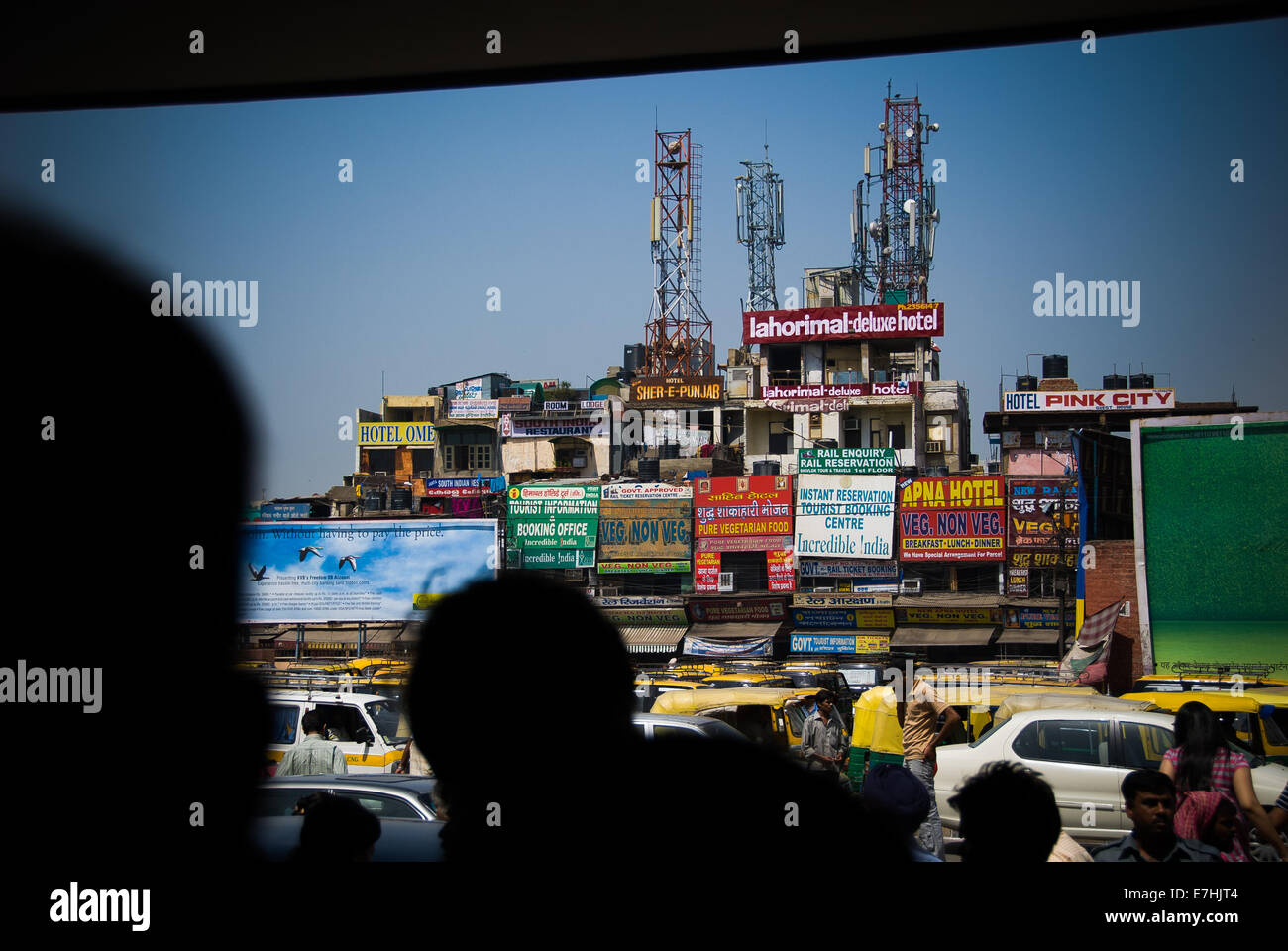 View leaving New Delhi Railway station with many placards advertising ...