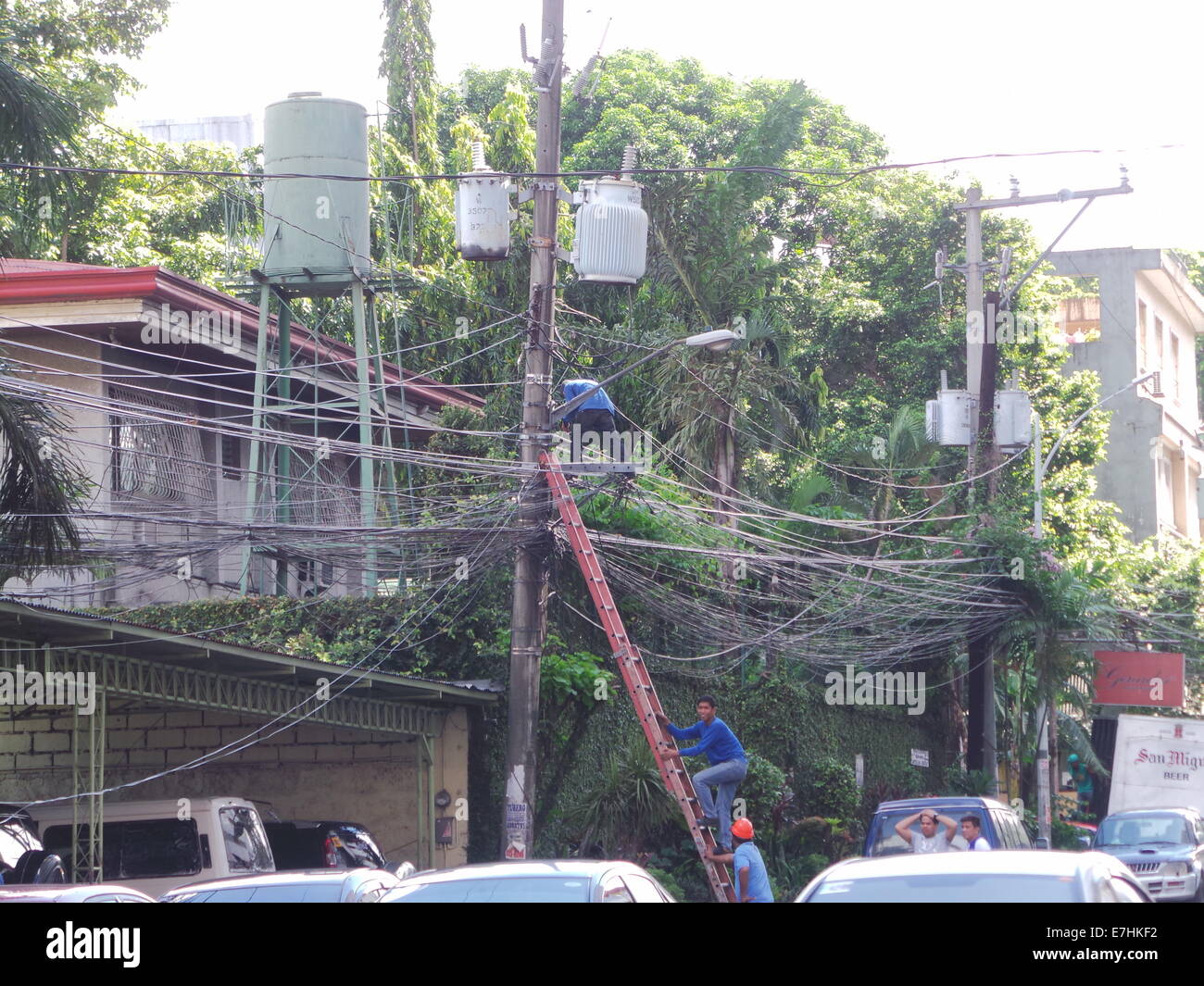 Manila, Philippines. 18 September, 2014. Men from electric company ...