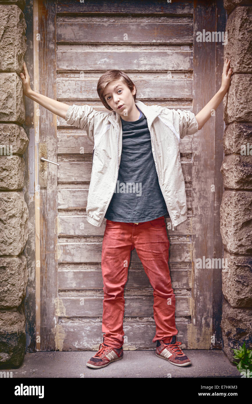 cool teenager boy standing in an entrance Stock Photo - Alamy