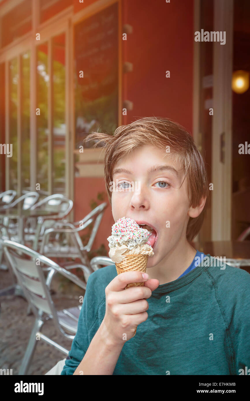 lucky teenager boy is eating his ice cream Stock Photo - Alamy