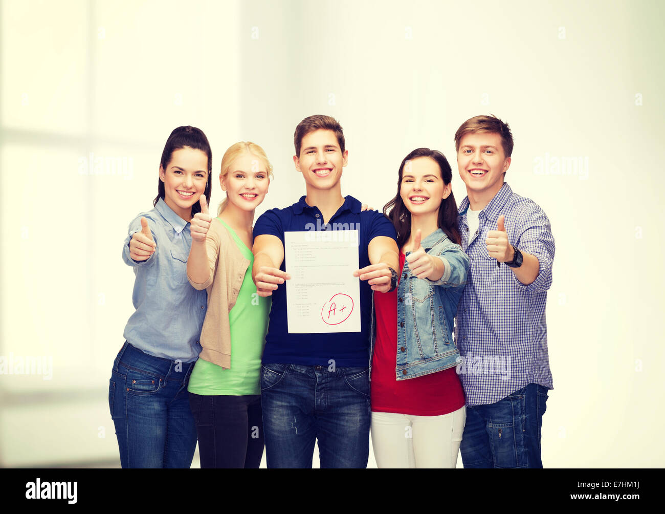 Group students showing test thumbs hi-res stock photography and images ...