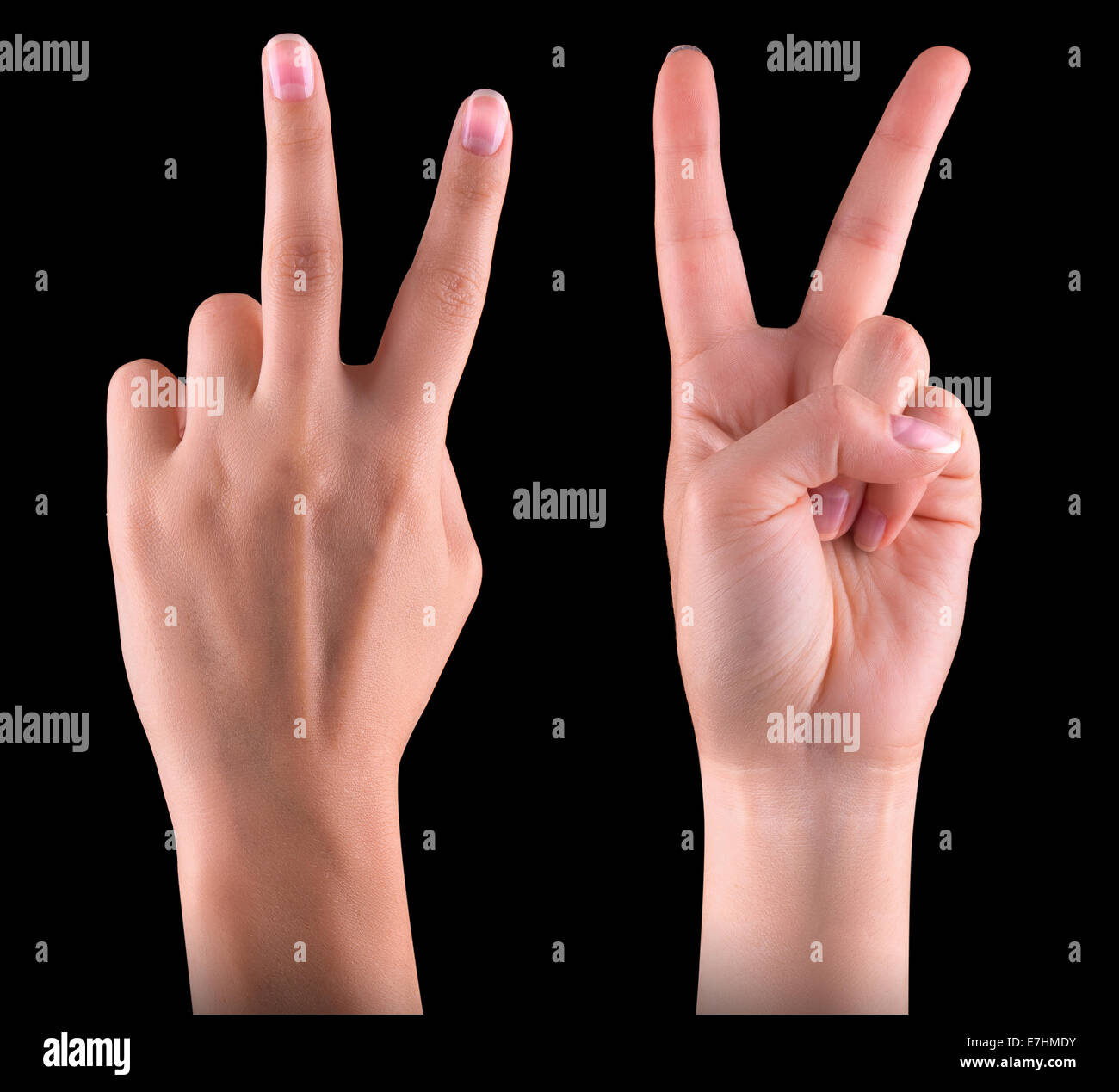 Hand showing the sign of victory and peace closeup isolated on black ...