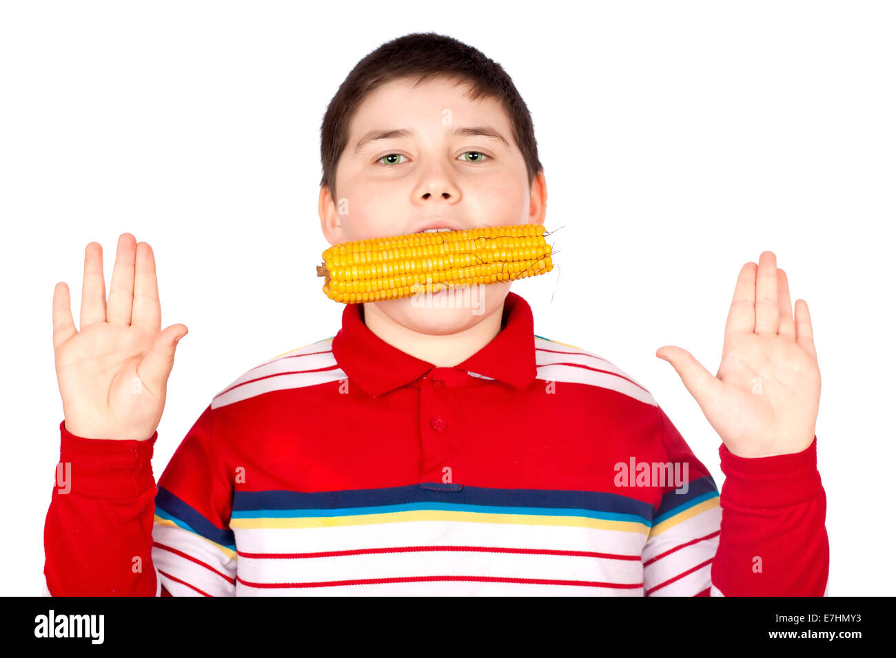 Boy eating fresh boiled corn isolated over white background Stock Photo ...