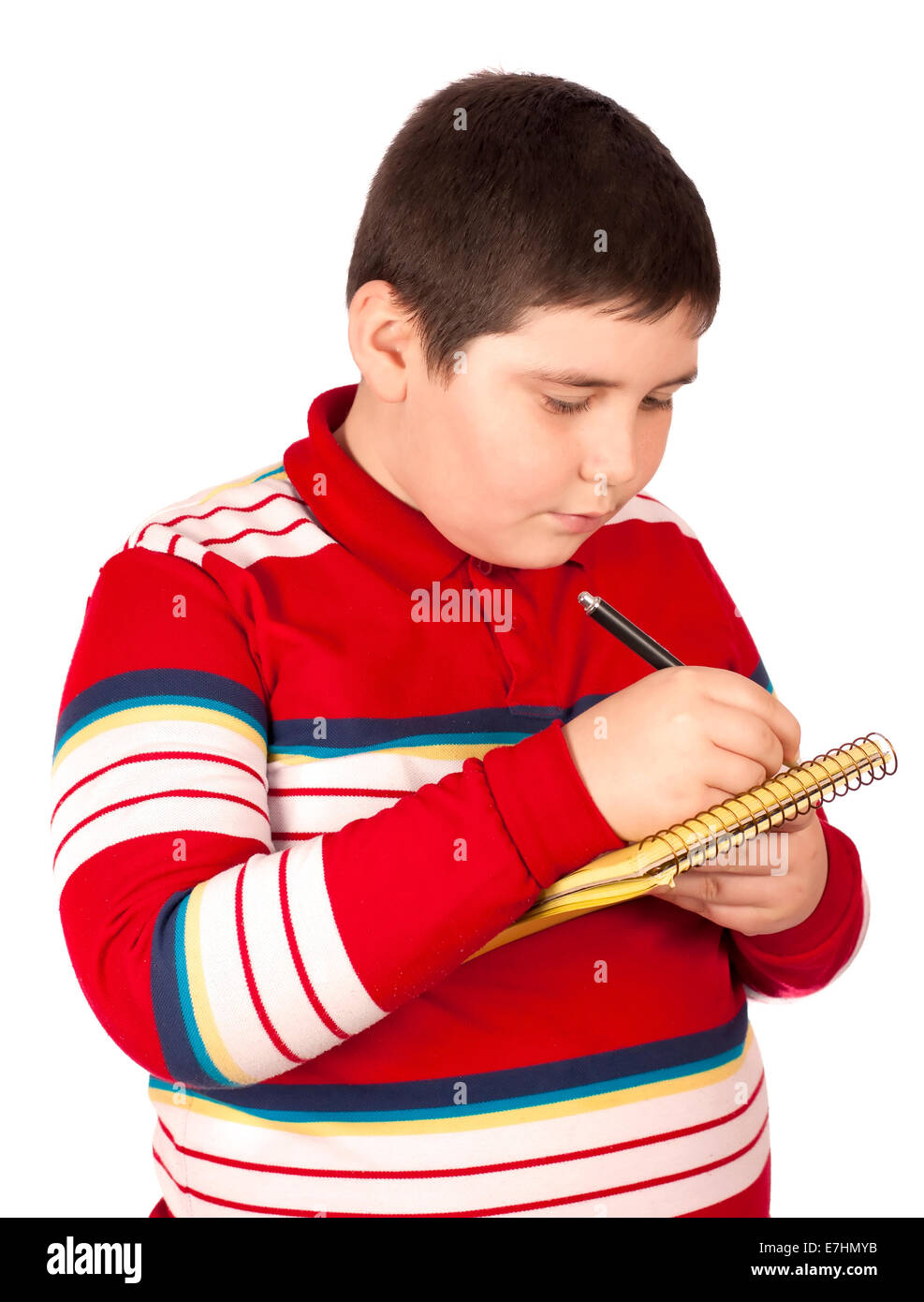 Boy who writes on a notepad isolated over white background Stock Photo ...