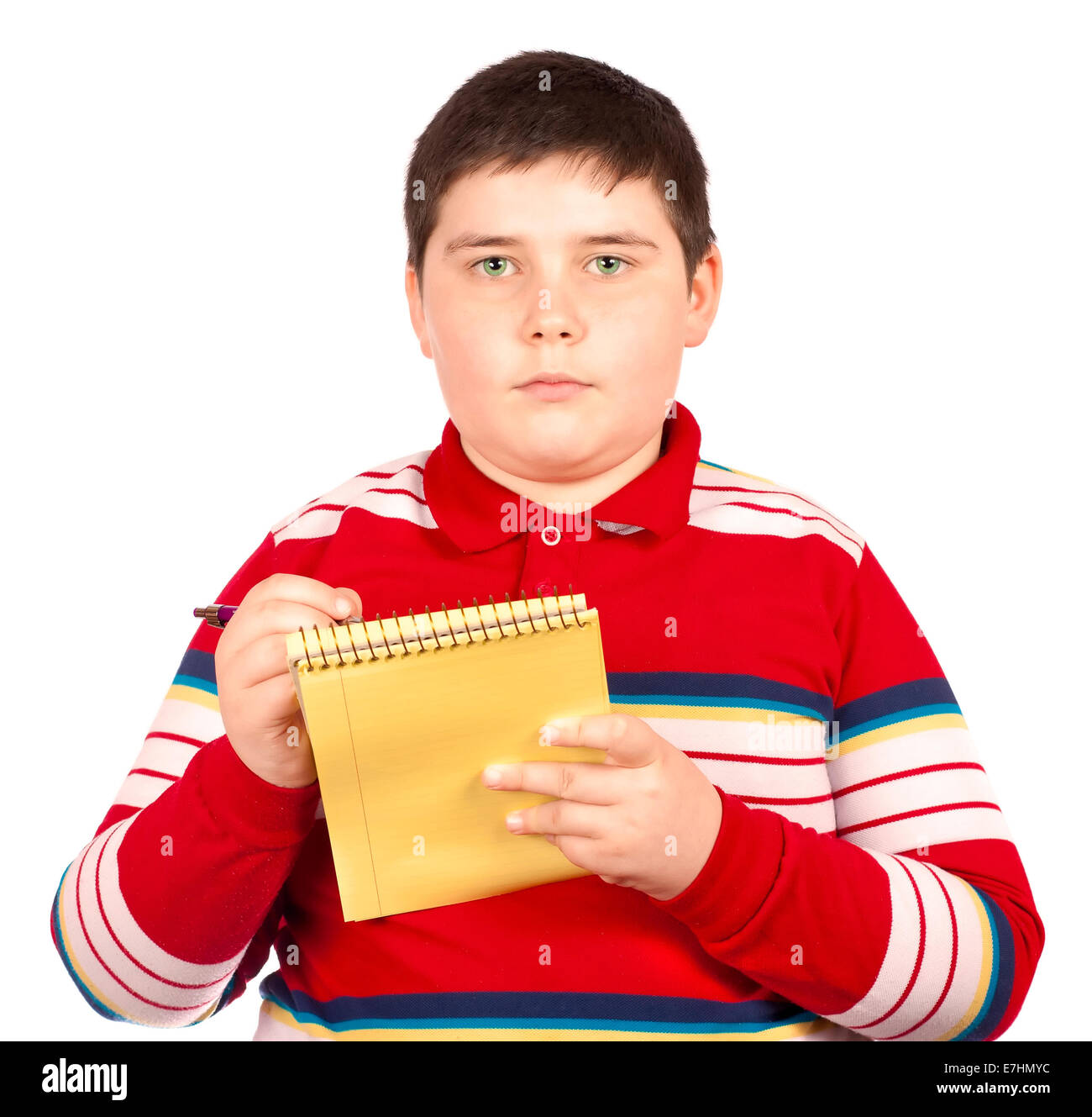 Boy who writes on a notepad isolated over white background Stock Photo ...