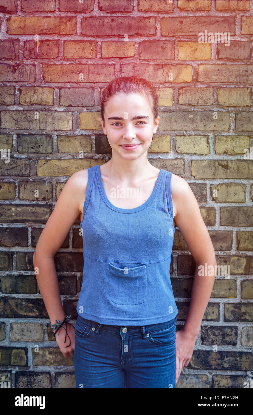 Teenager leaning against a brick wall hi-res stock photography and ...