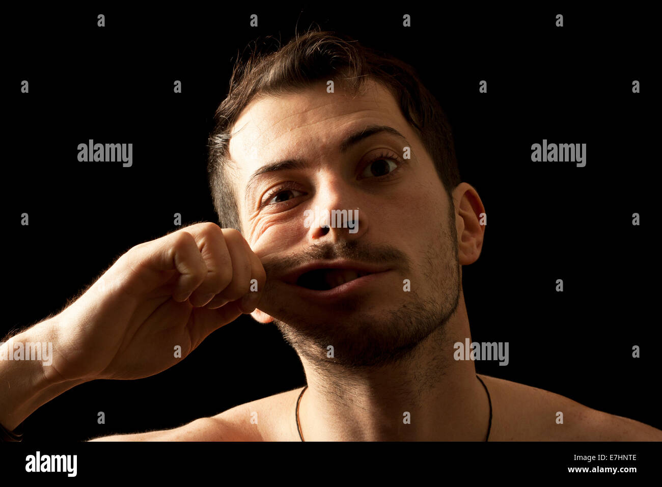 Funny man who pulls his cheek hi-res stock photography and images - Alamy