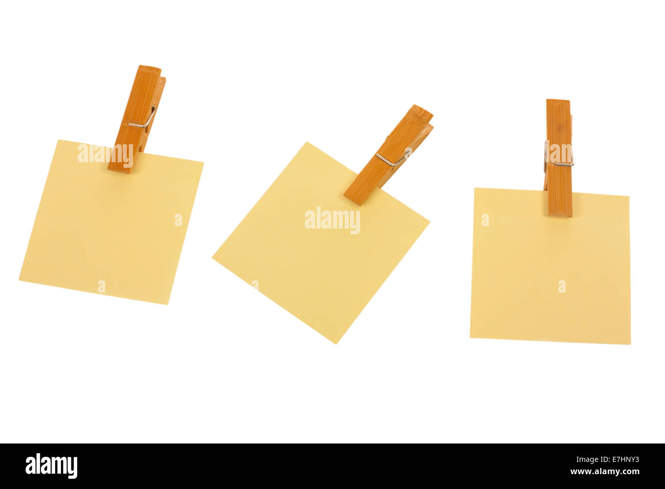 Three post it with pegs isolated on white background Stock Photo - Alamy