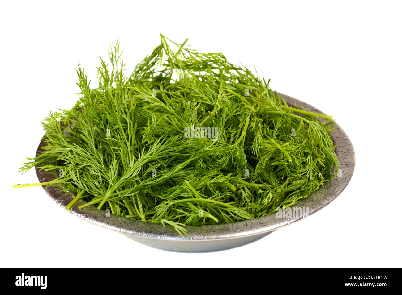 Fresh dill leaves in a metal bowl isolated over white background Stock ...