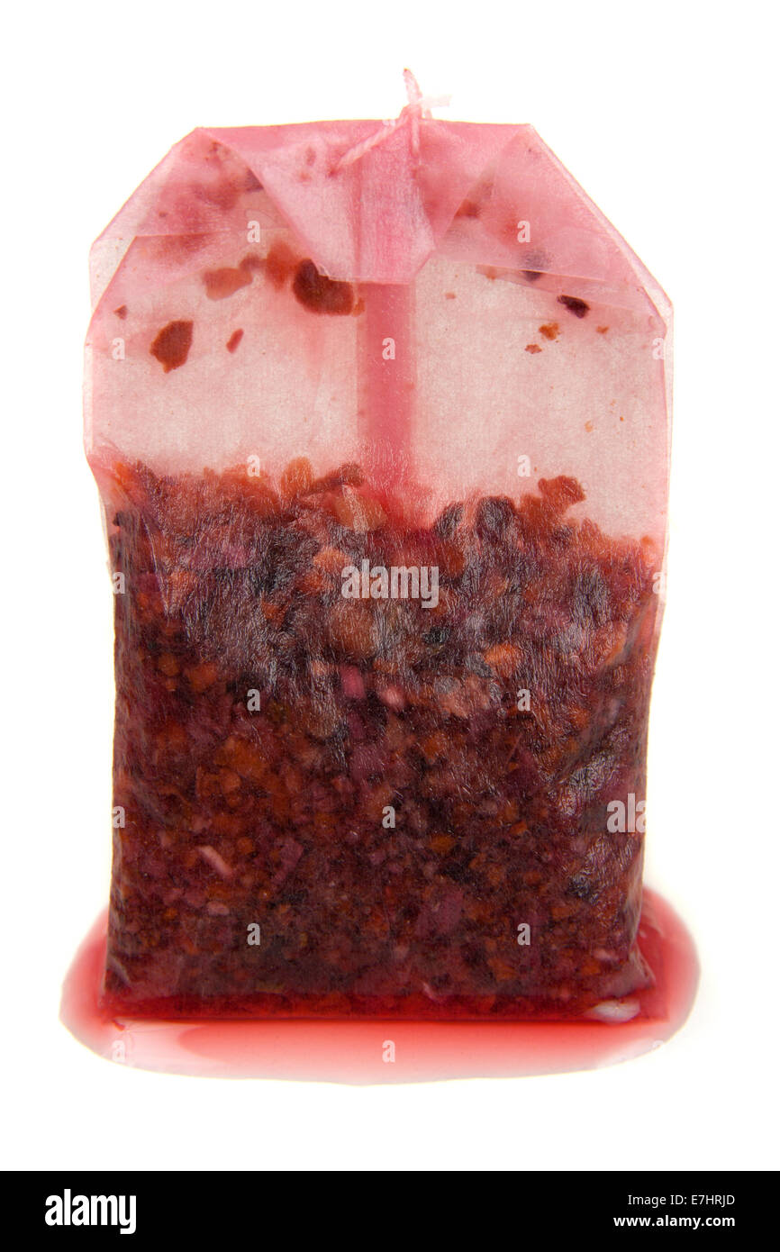 An red used-up tea bag isolated on white background Stock Photo - Alamy