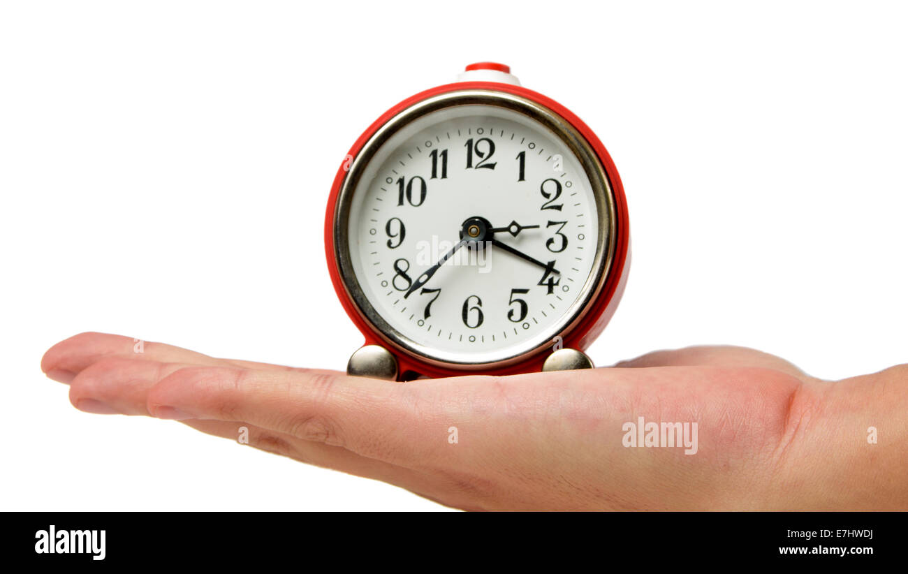 Man holding a clock in his hand isolated over white background Stock ...