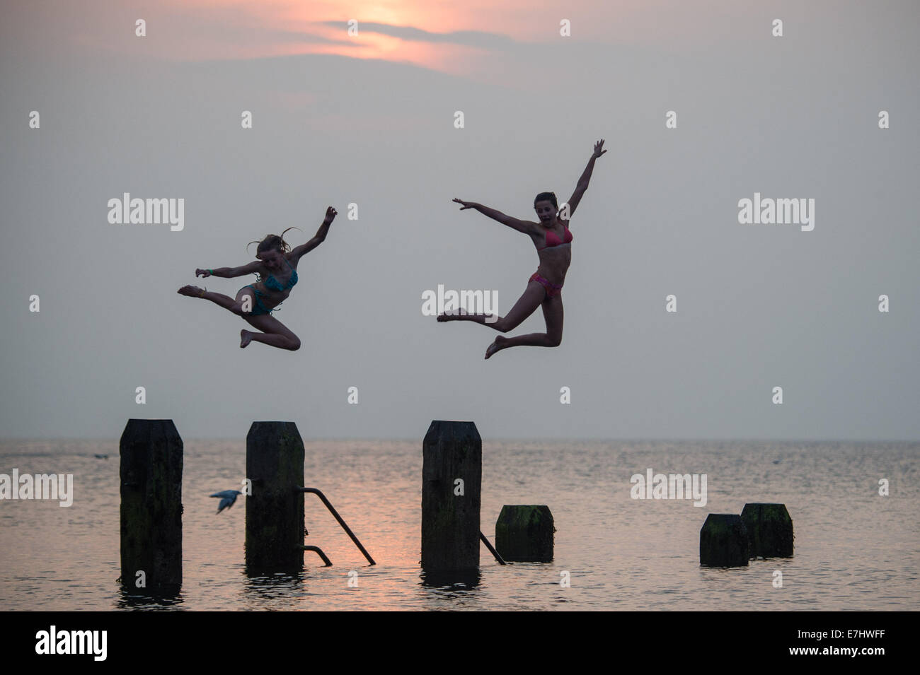 Children jumping into water silhouette hi-res stock photography and ...
