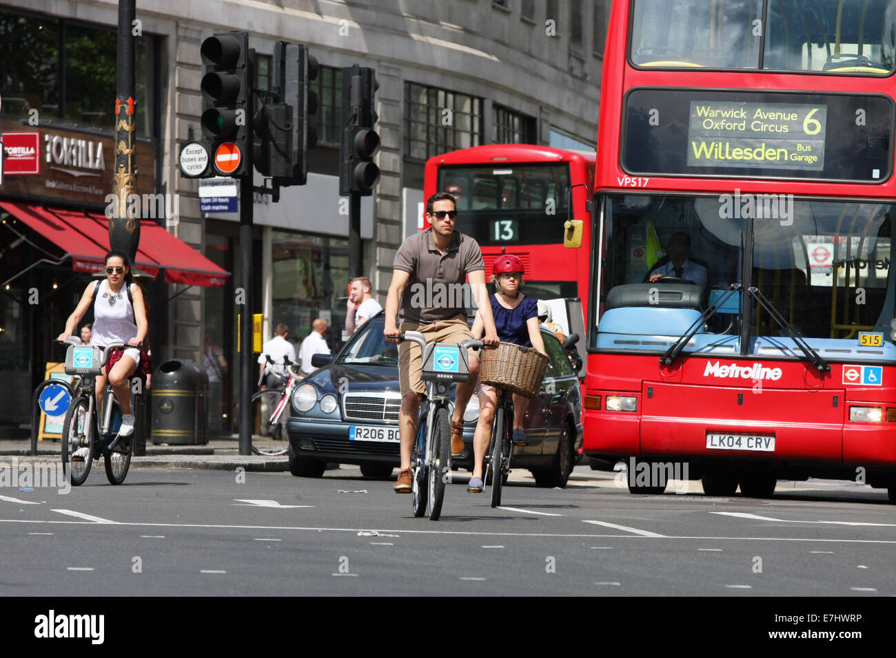 Car behind cyclists hi-res stock photography and images - Alamy