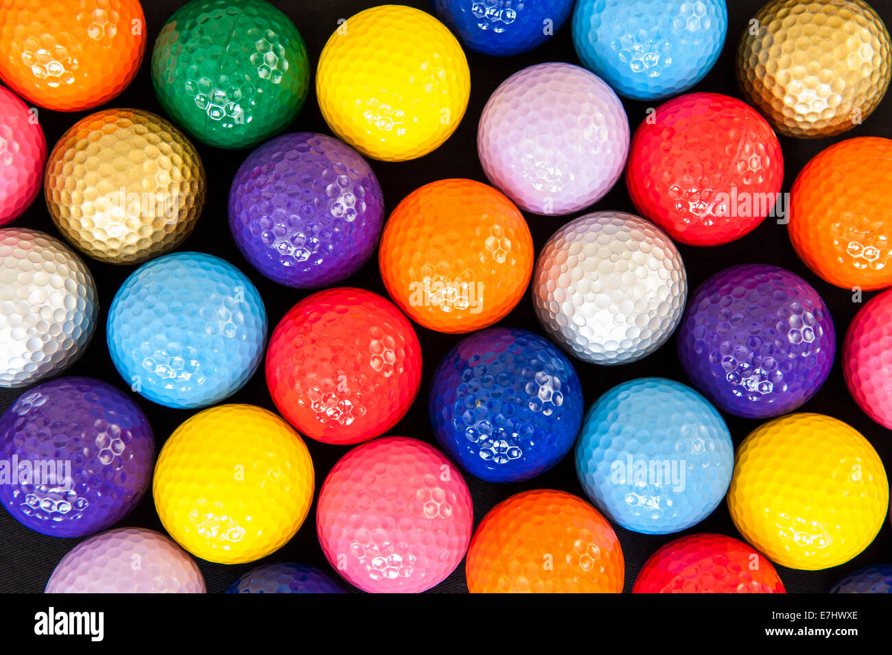 Assortment of colorful mini golf balls on black Stock Photo - Alamy