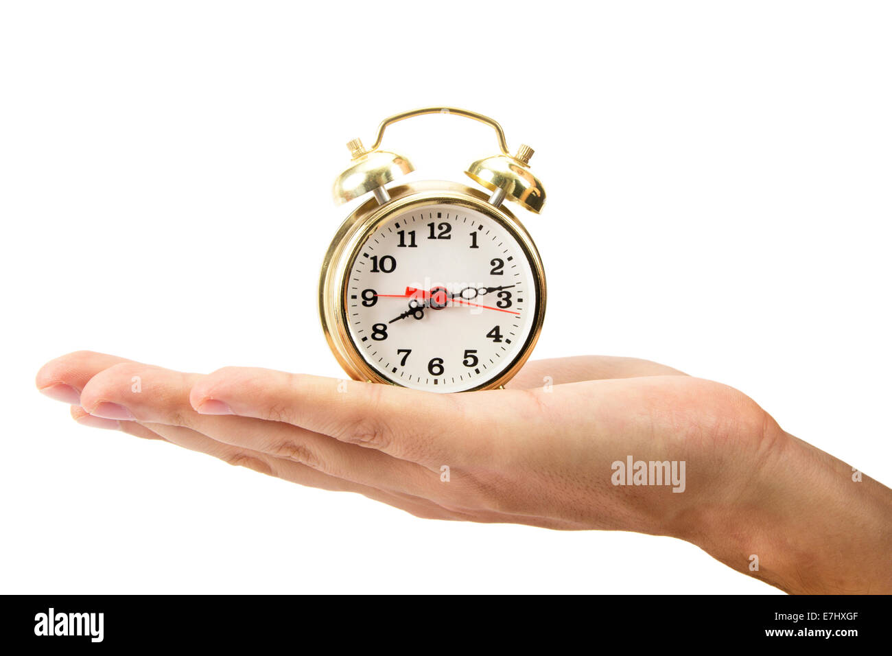 Hand holding clock hi-res stock photography and images - Alamy