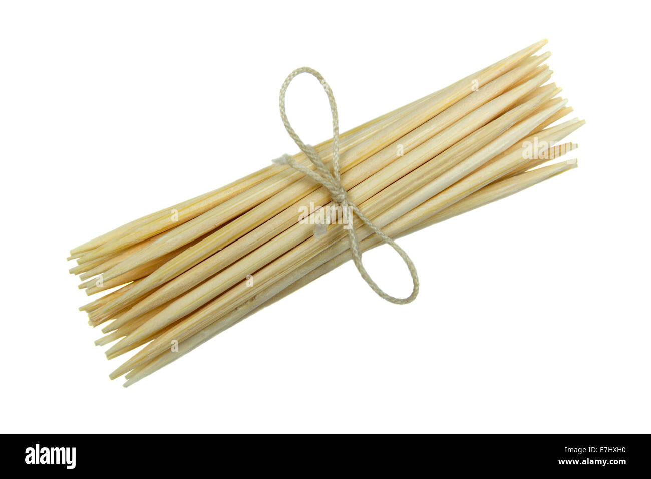 Toothpicks with ribbon isolated over white background Stock Photo - Alamy