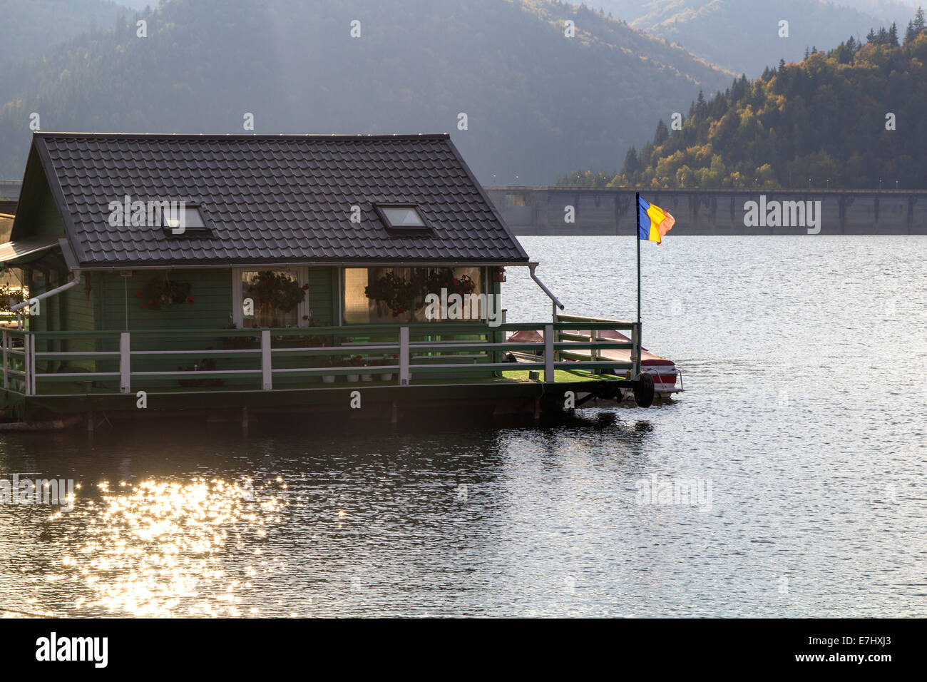 Floating house in the Bicaz lake in Romania Stock Photo - Alamy