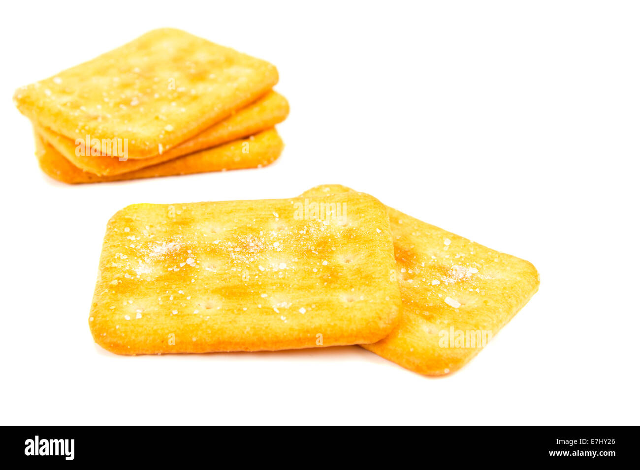 Some saltine crackers isolated over white background Stock Photo - Alamy