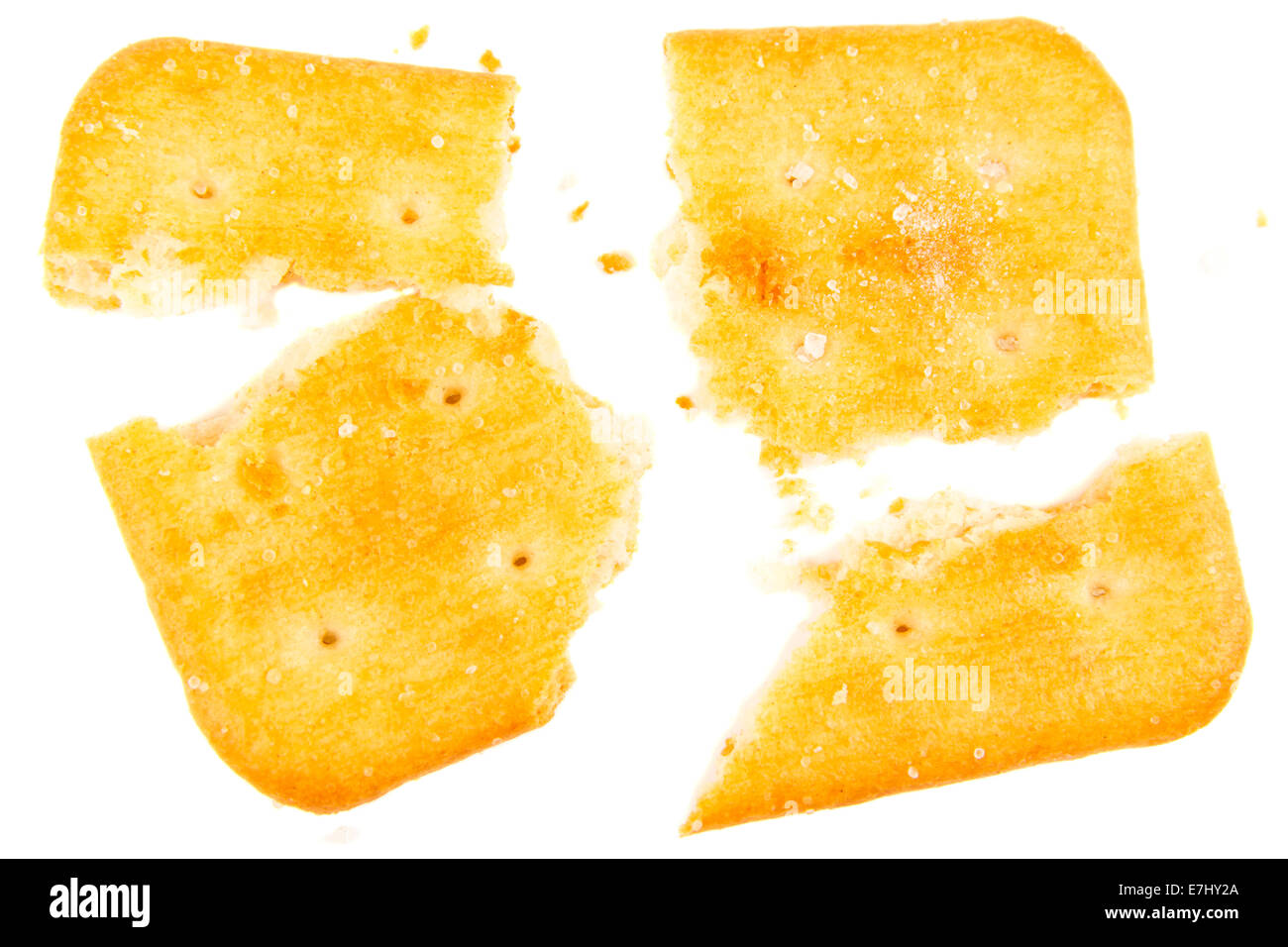 Broken cracker isolated on white background Stock Photo - Alamy