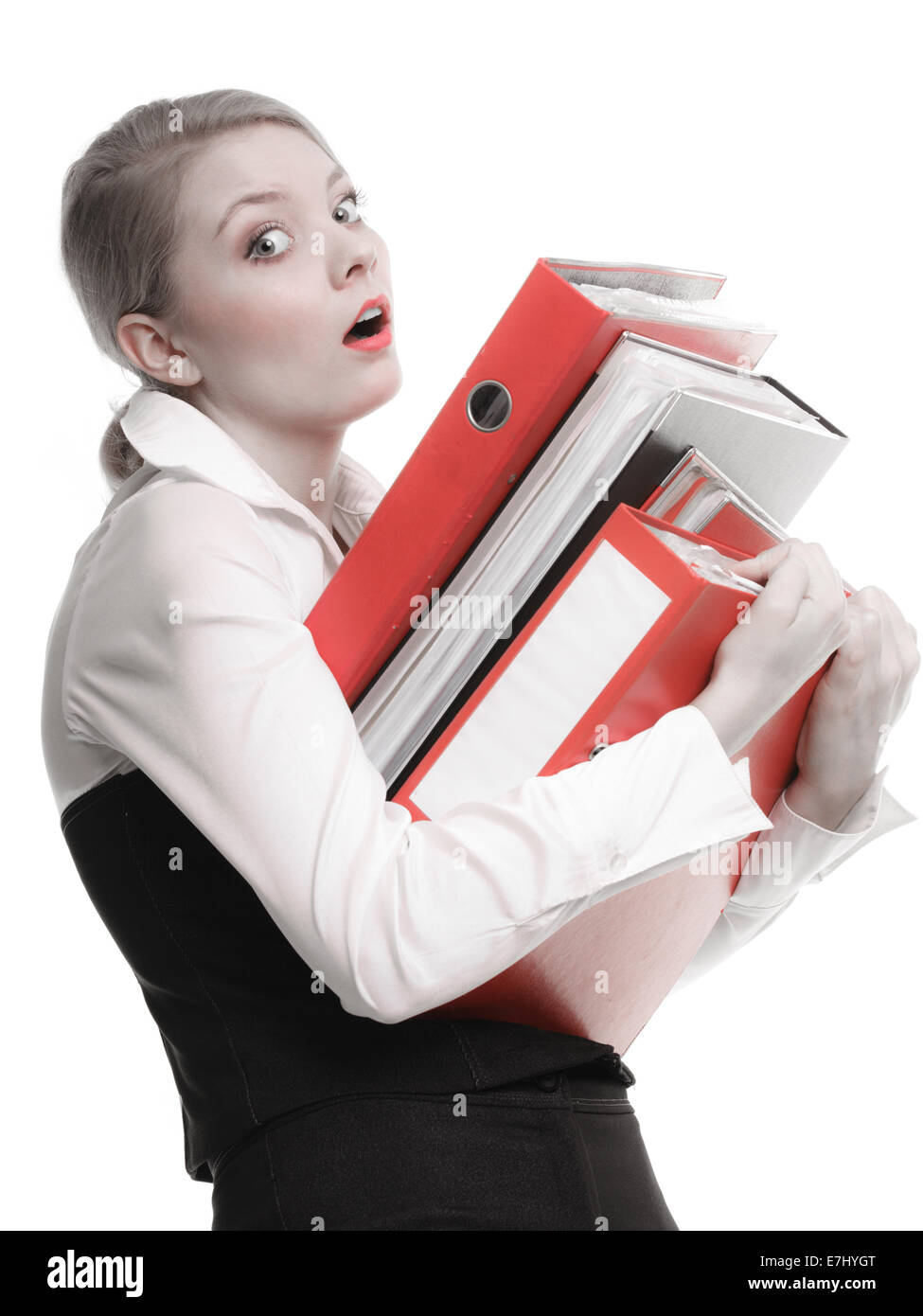 Business and paperwork. Young overworked businesswoman holding stack of ...